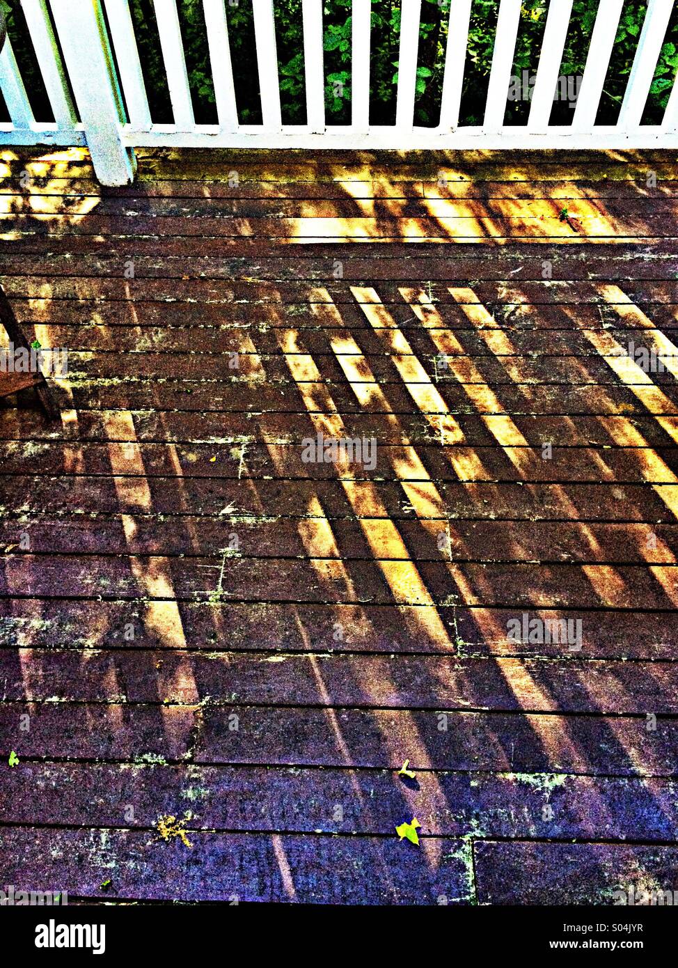Shadows on back porch deck Stock Photo - Alamy