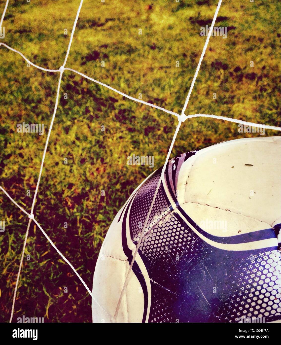 Football in net Stock Photo - Alamy