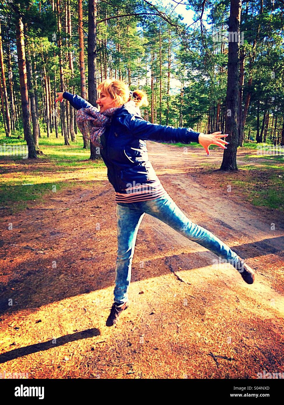 Jumping in the forest Stock Photo - Alamy