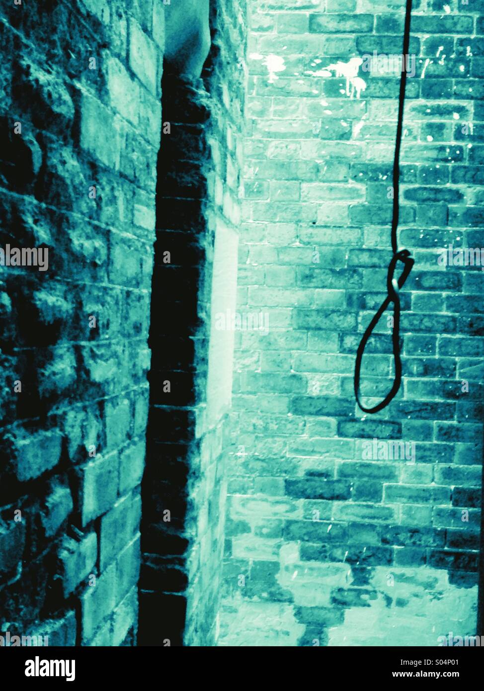 Eerie image of wire noose in narrow brick passageway Stock Photo - Alamy