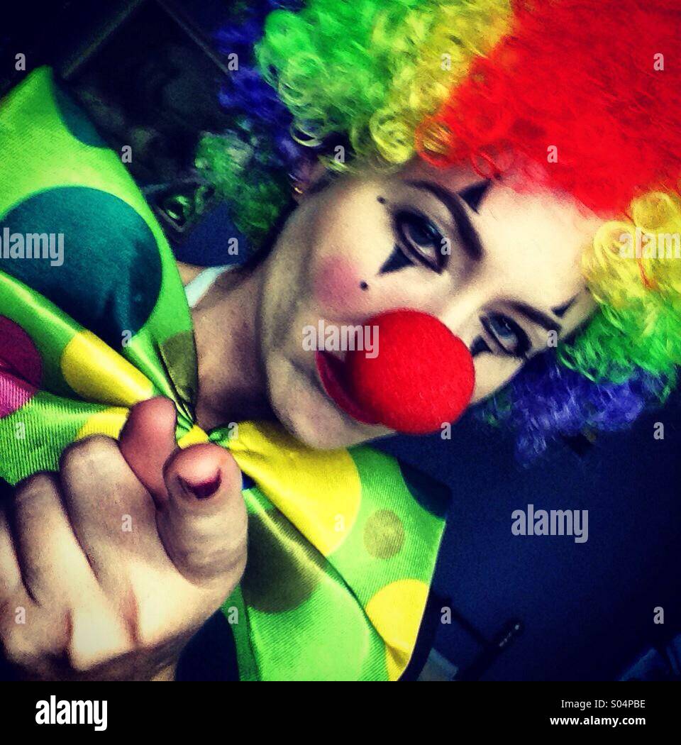 Scary clown pointing finger Stock Photo - Alamy