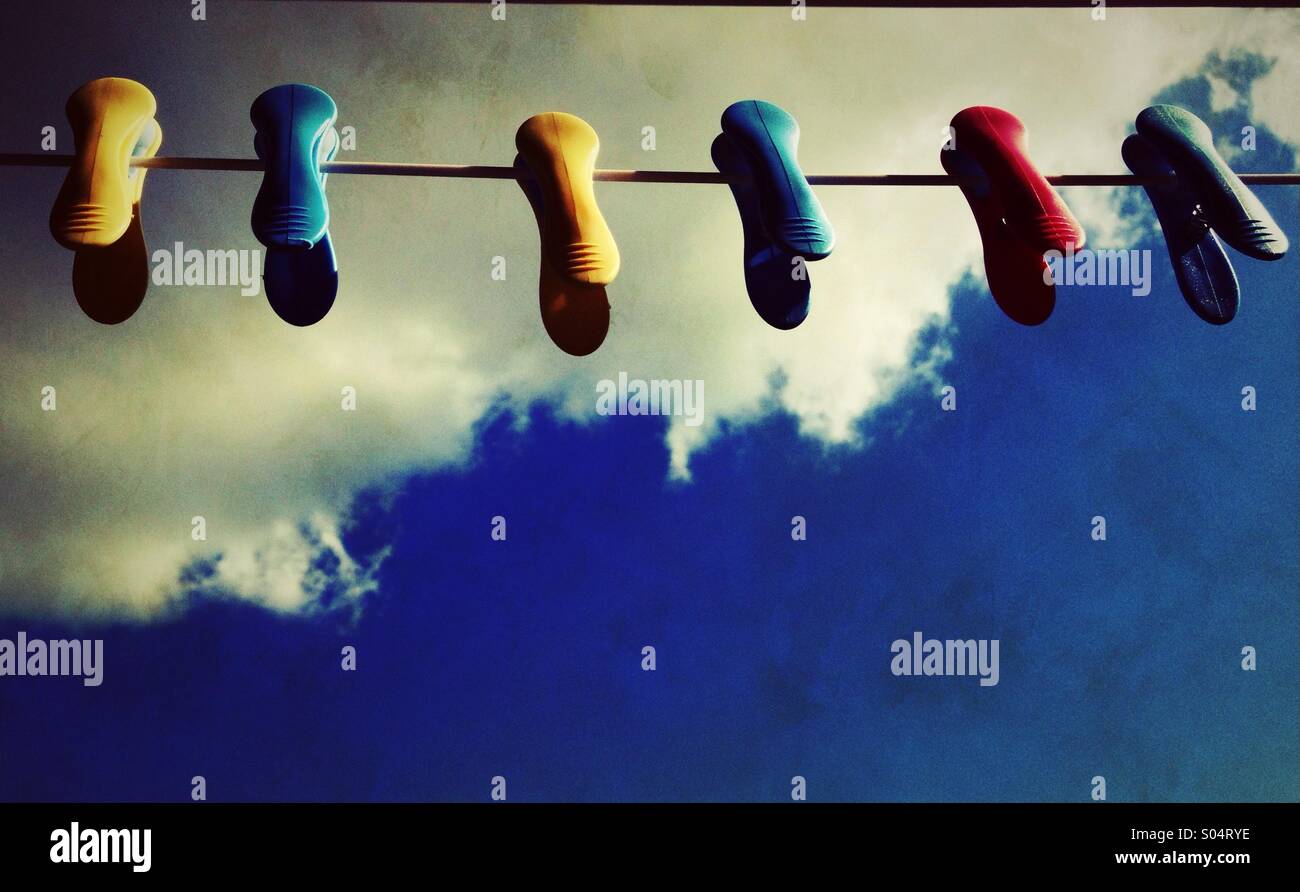 Colourful pegs on washing line Stock Photo - Alamy