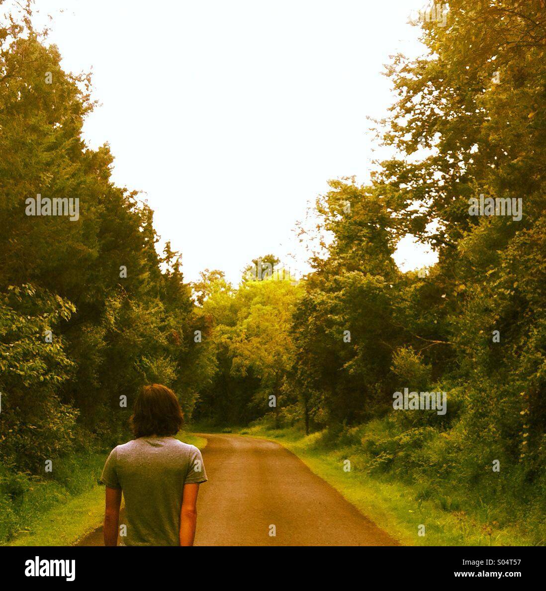 Man walking down path High Resolution Stock Photography and Images - Alamy