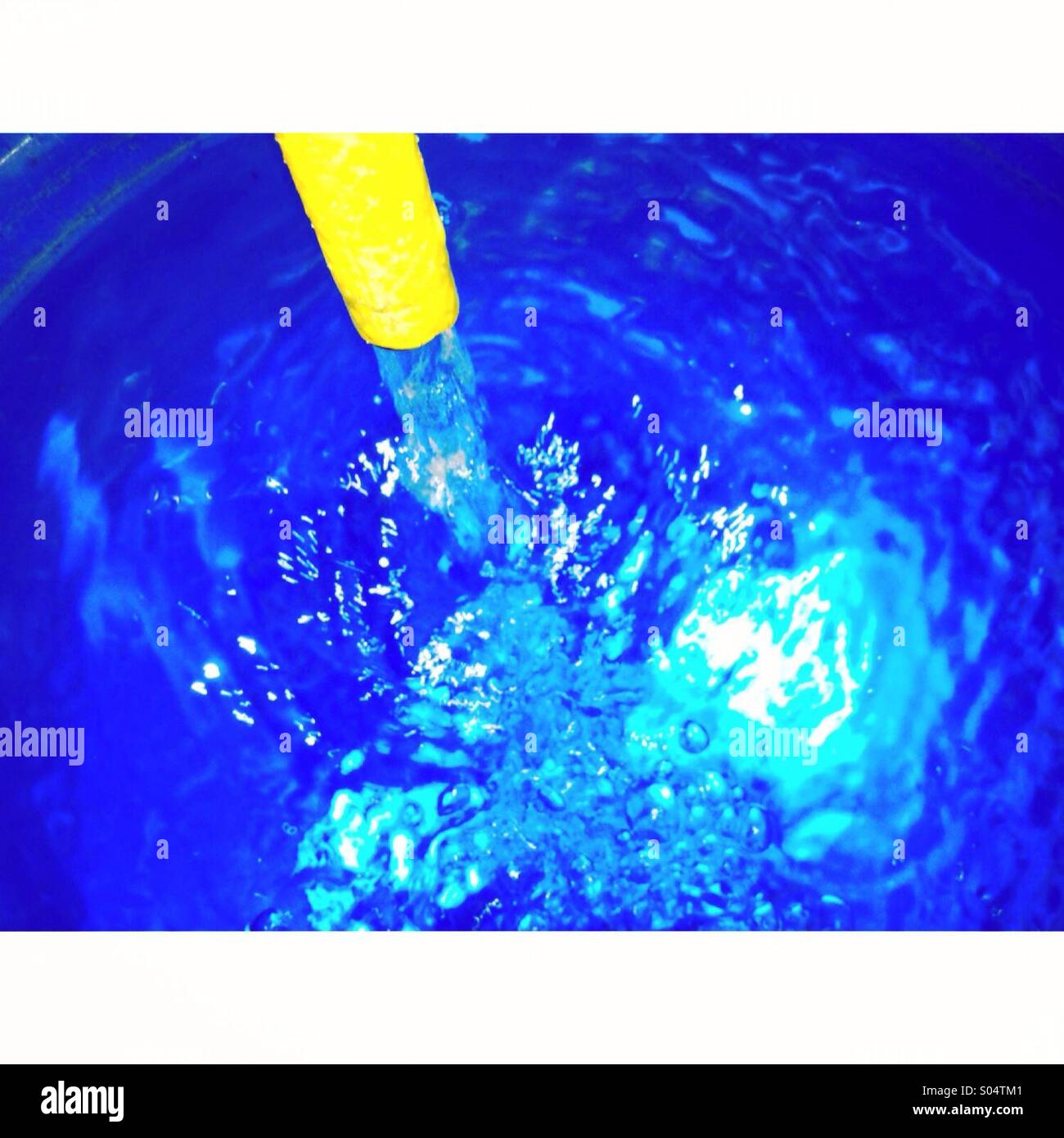 filling the bucket with water Stock Photo - Alamy