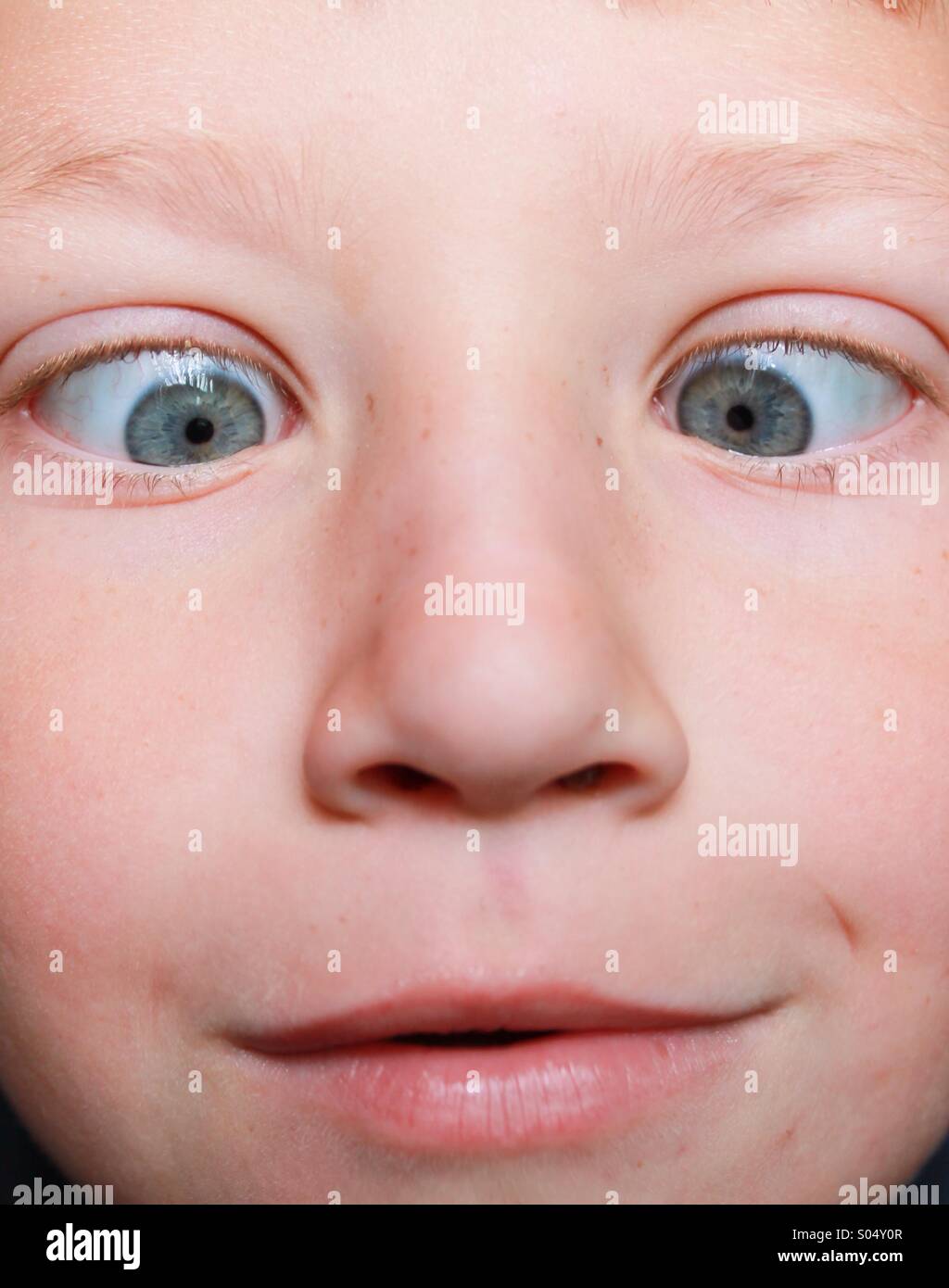 Cross eyed child funny face hi-res stock photography and images - Alamy