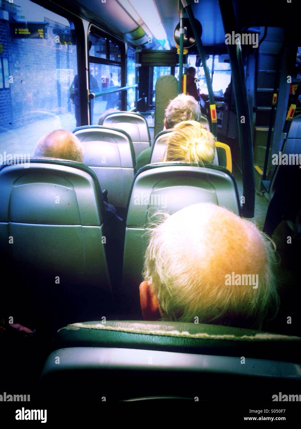 Passengers on a bus Stock Photo - Alamy