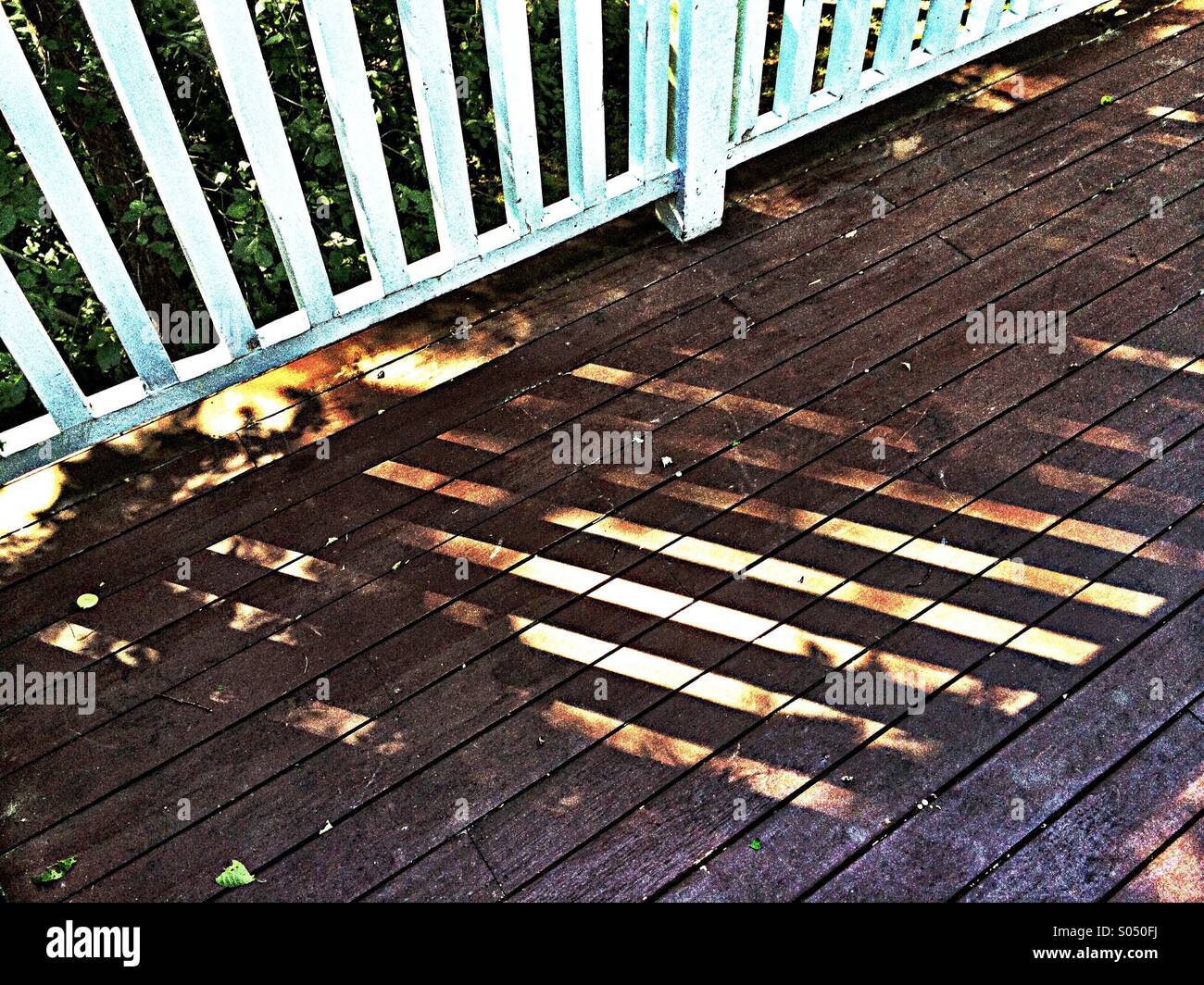 Shadows on the porch on the summer afternoon from a railing Stock Photo ...