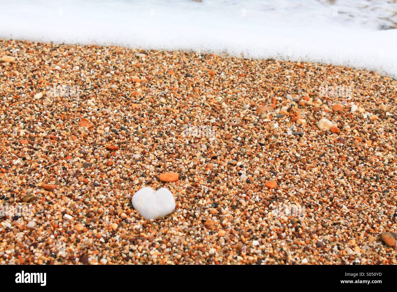 Naturally heart shaped pebble Stock Photo - Alamy