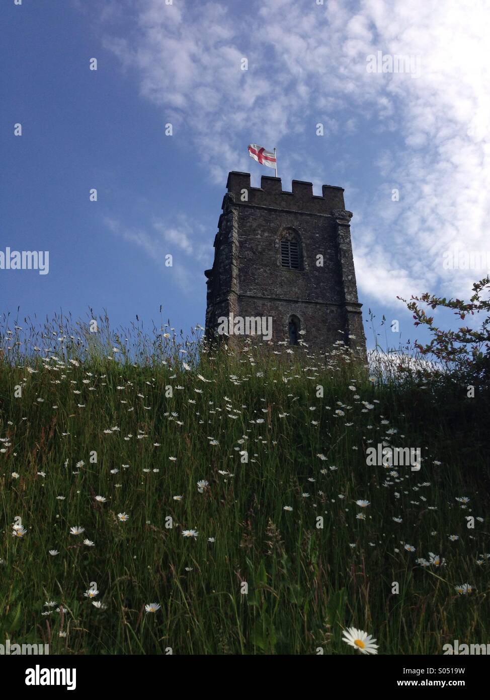 Old church flying England flag Stock Photo - Alamy