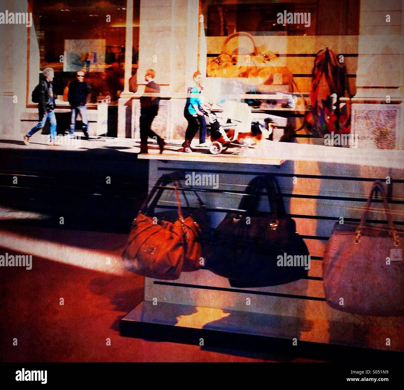 Reflection of baby strollers from a shop window Stock Photo - Alamy