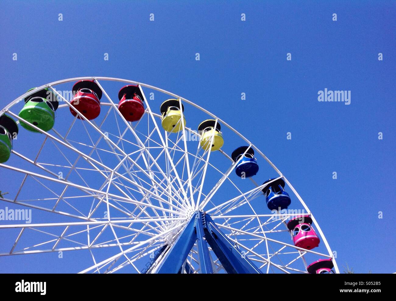 Panoramic wheel in blue sky Stock Photo - Alamy