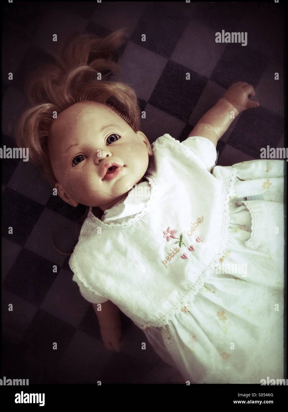 Female doll laying on back Stock Photo - Alamy