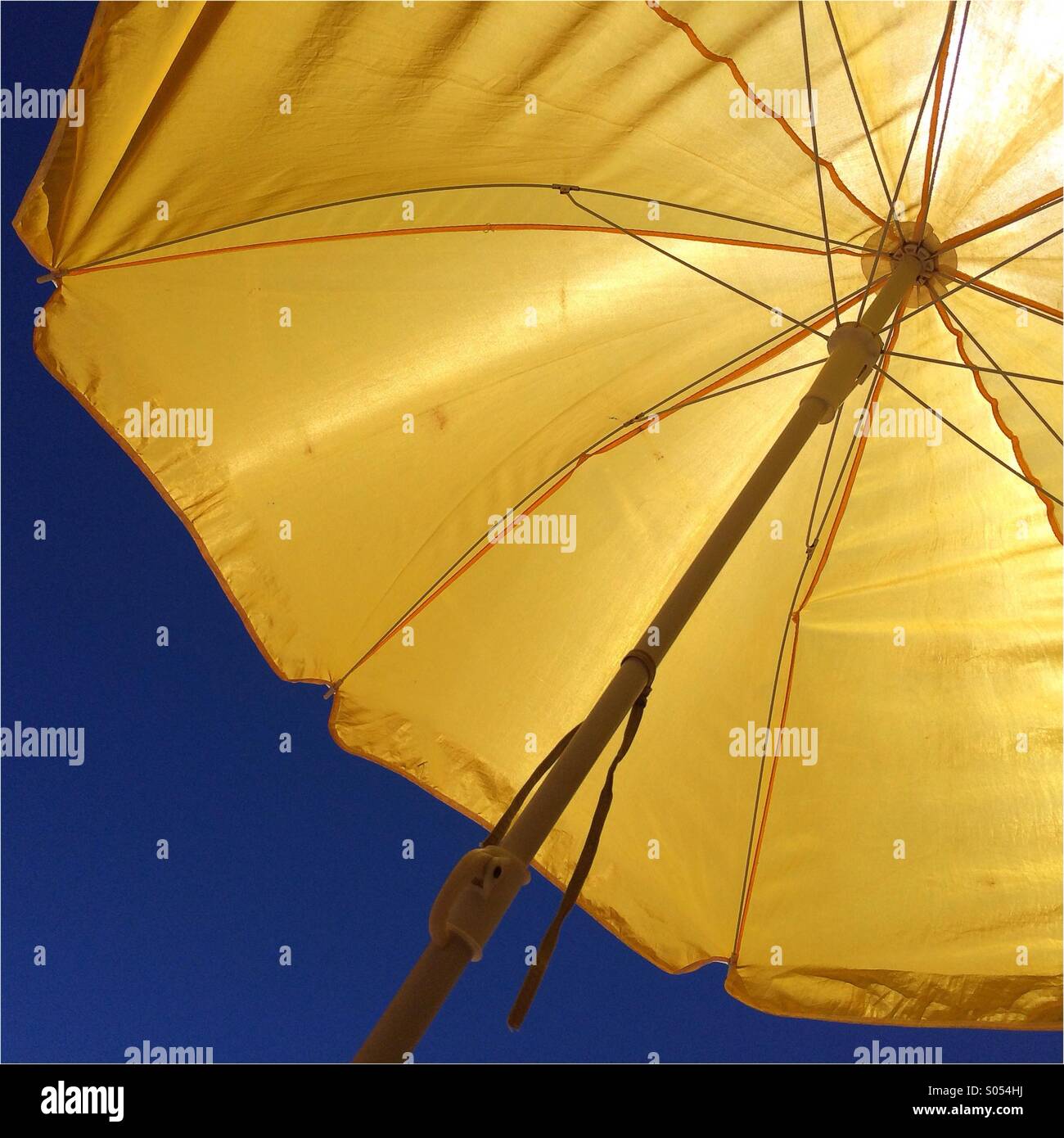 Yellow and blue parasol hi-res stock photography and images - Alamy