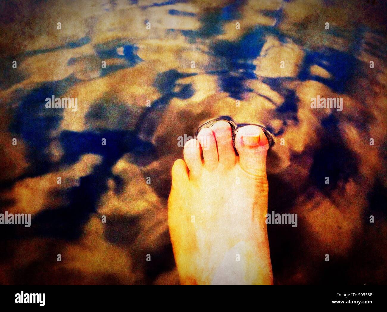 Dip toes hi-res stock photography and images - Alamy