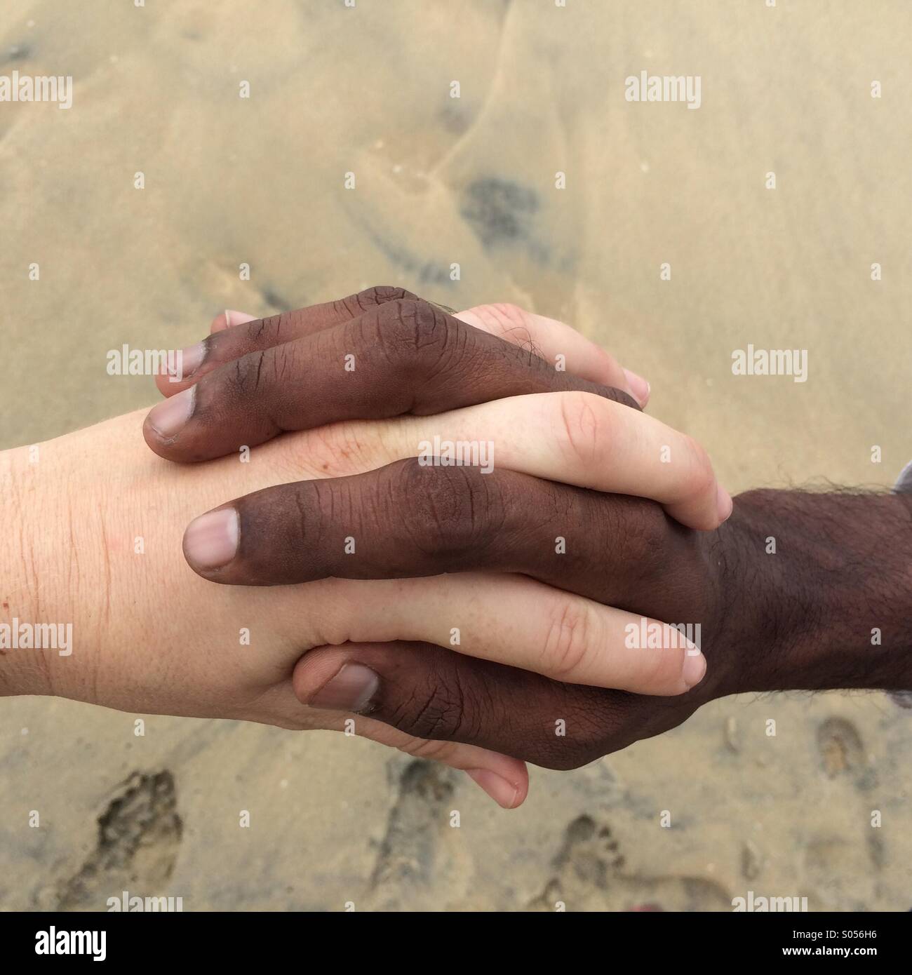 Black white hands hi-res stock photography and images - Alamy