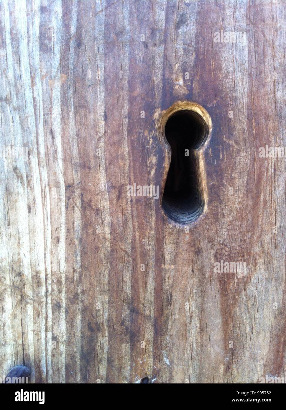 Hand carved keyhole in antique door Stock Photo - Alamy