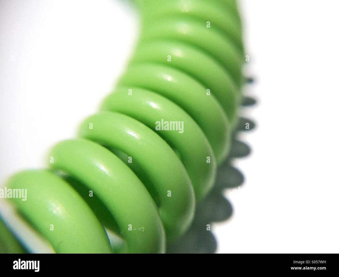Macro of a curled green cable Stock Photo - Alamy