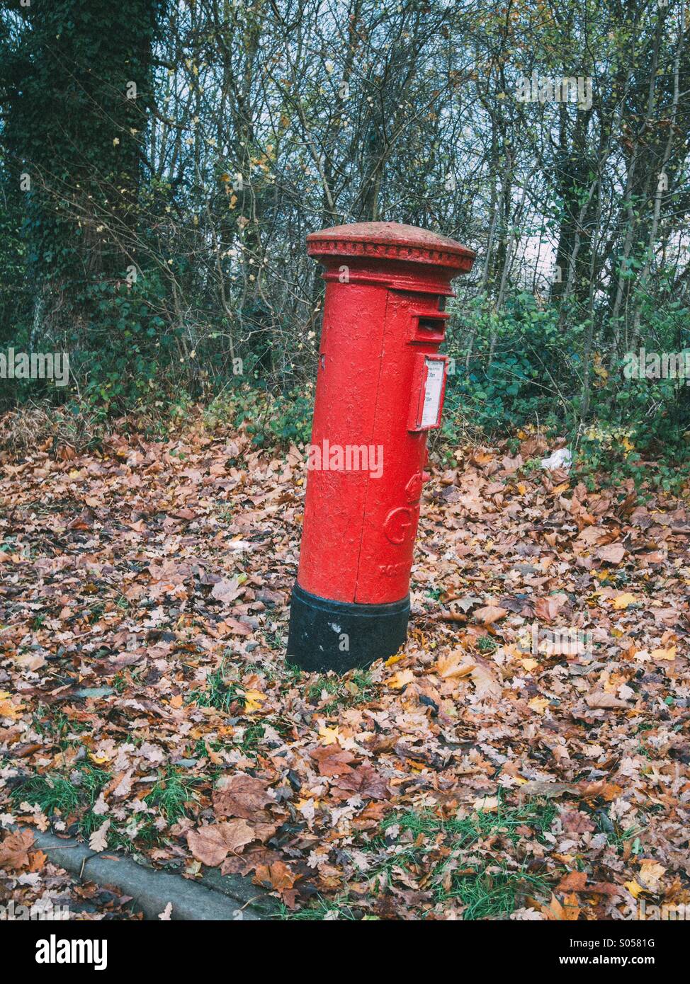 Leaning post box Stock Photo - Alamy