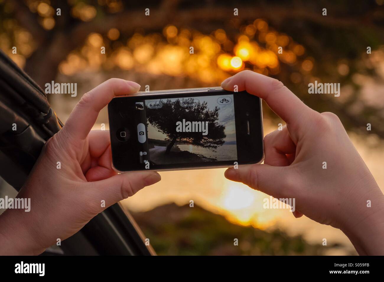 Female taking picture with smart phone Stock Photo - Alamy
