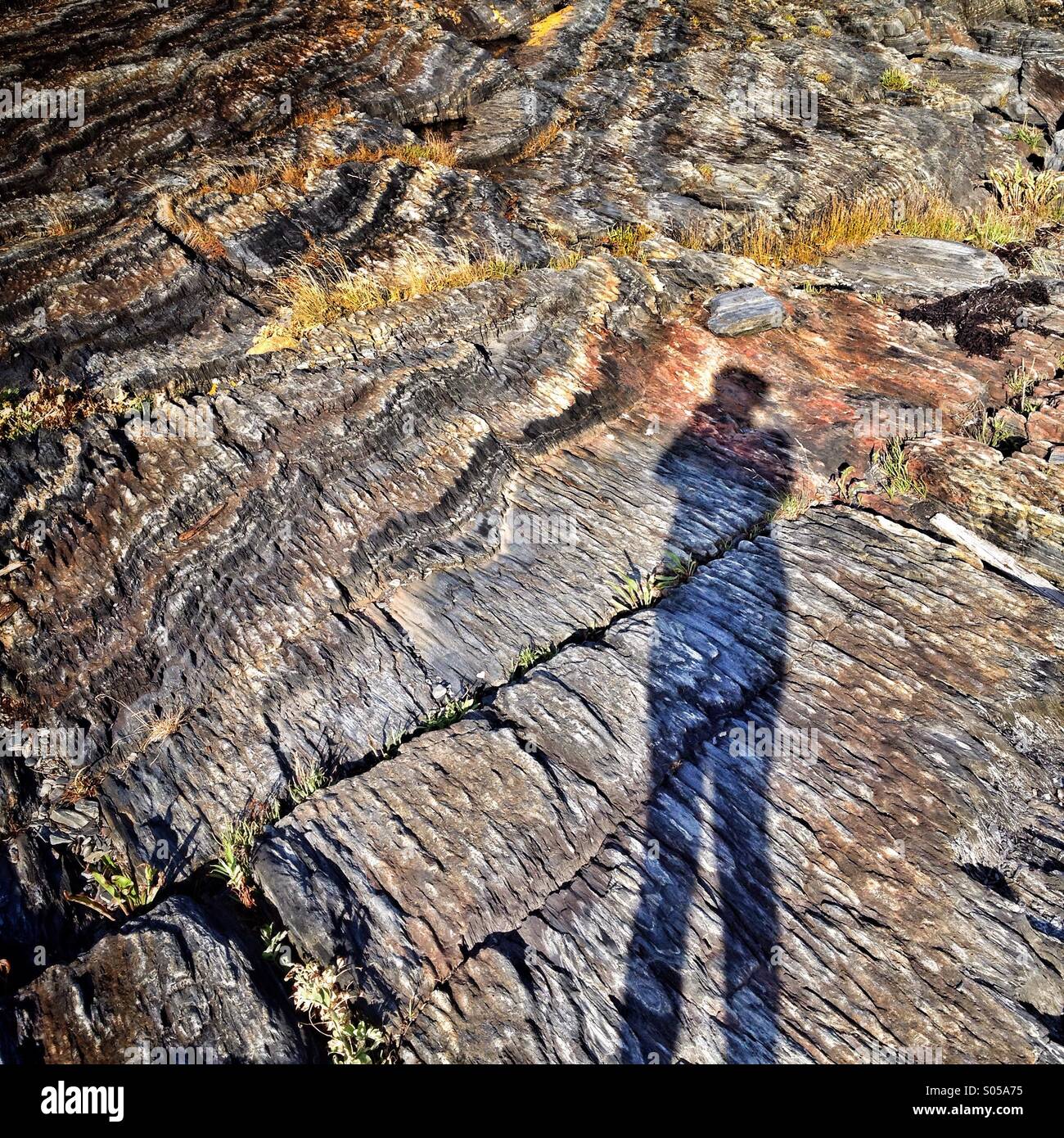 Shadow on rocks Stock Photo - Alamy