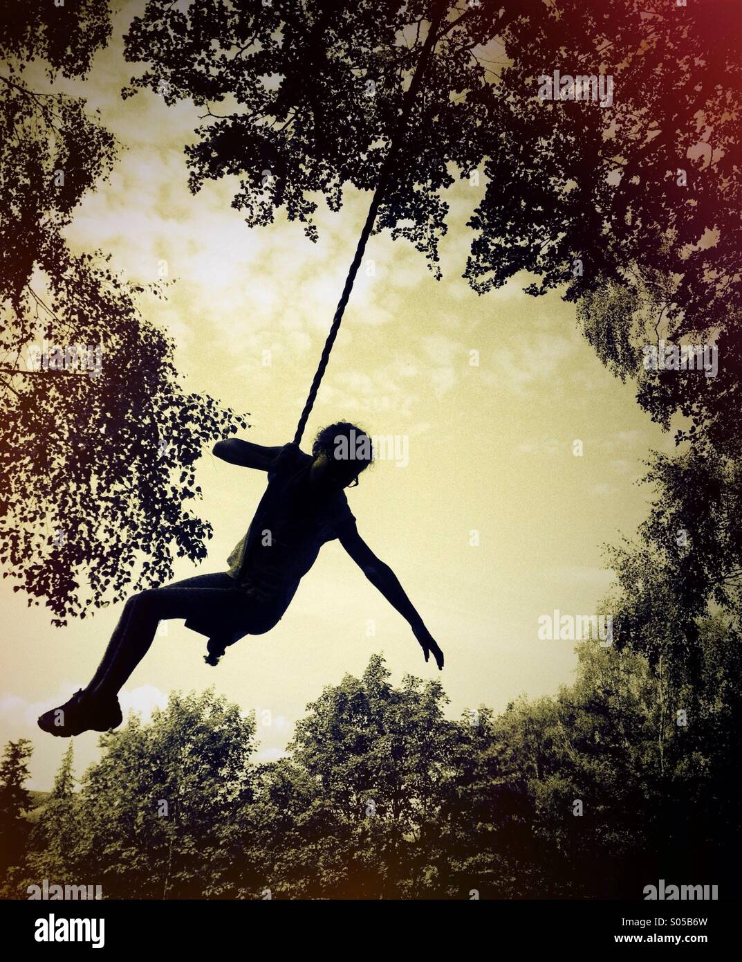 Girl on swing rope hi-res stock photography and images - Alamy