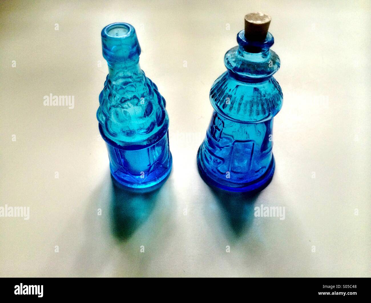 Two blue bottles Stock Photo - Alamy