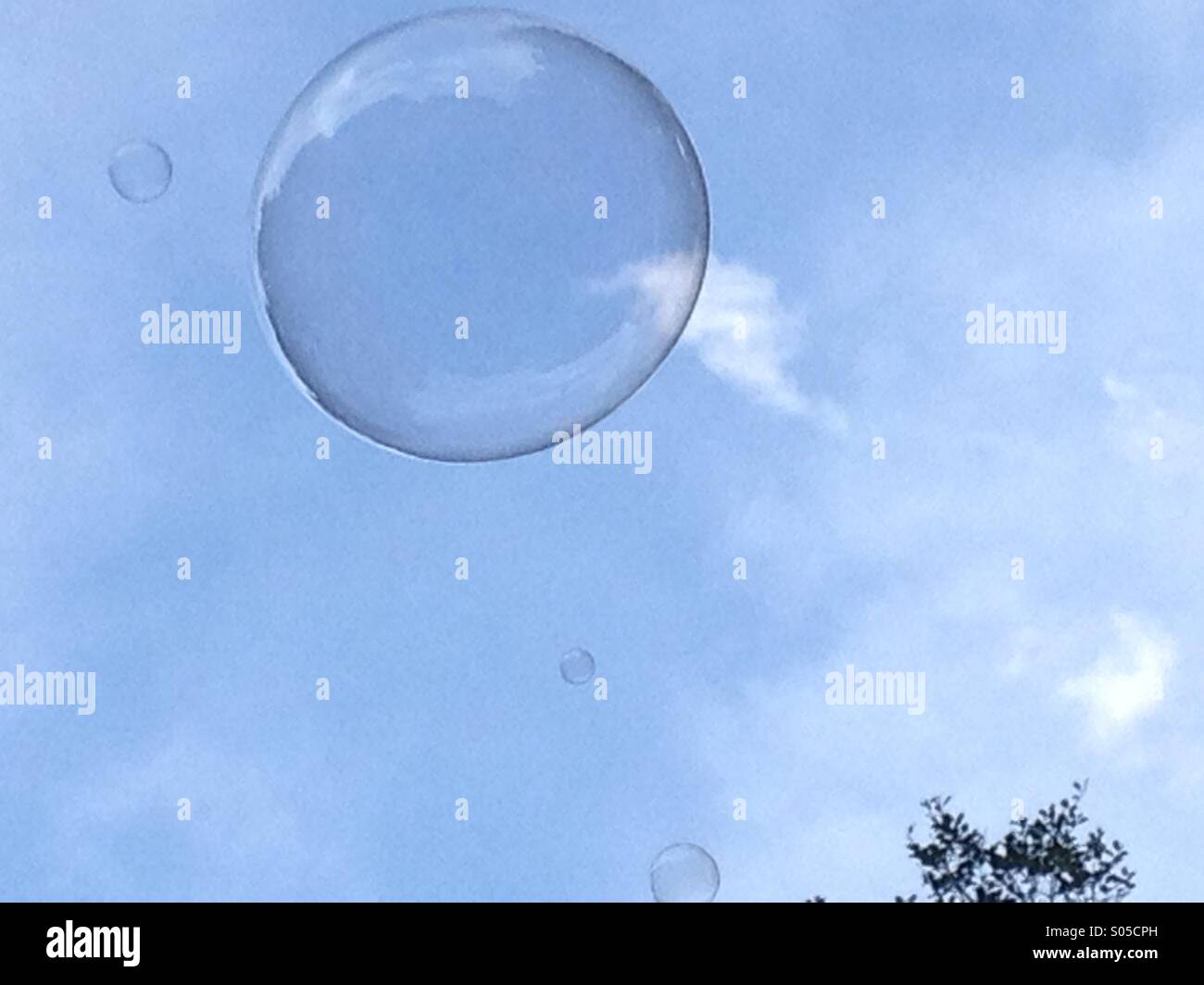 Soap bubble floating away hi-res stock photography and images - Alamy