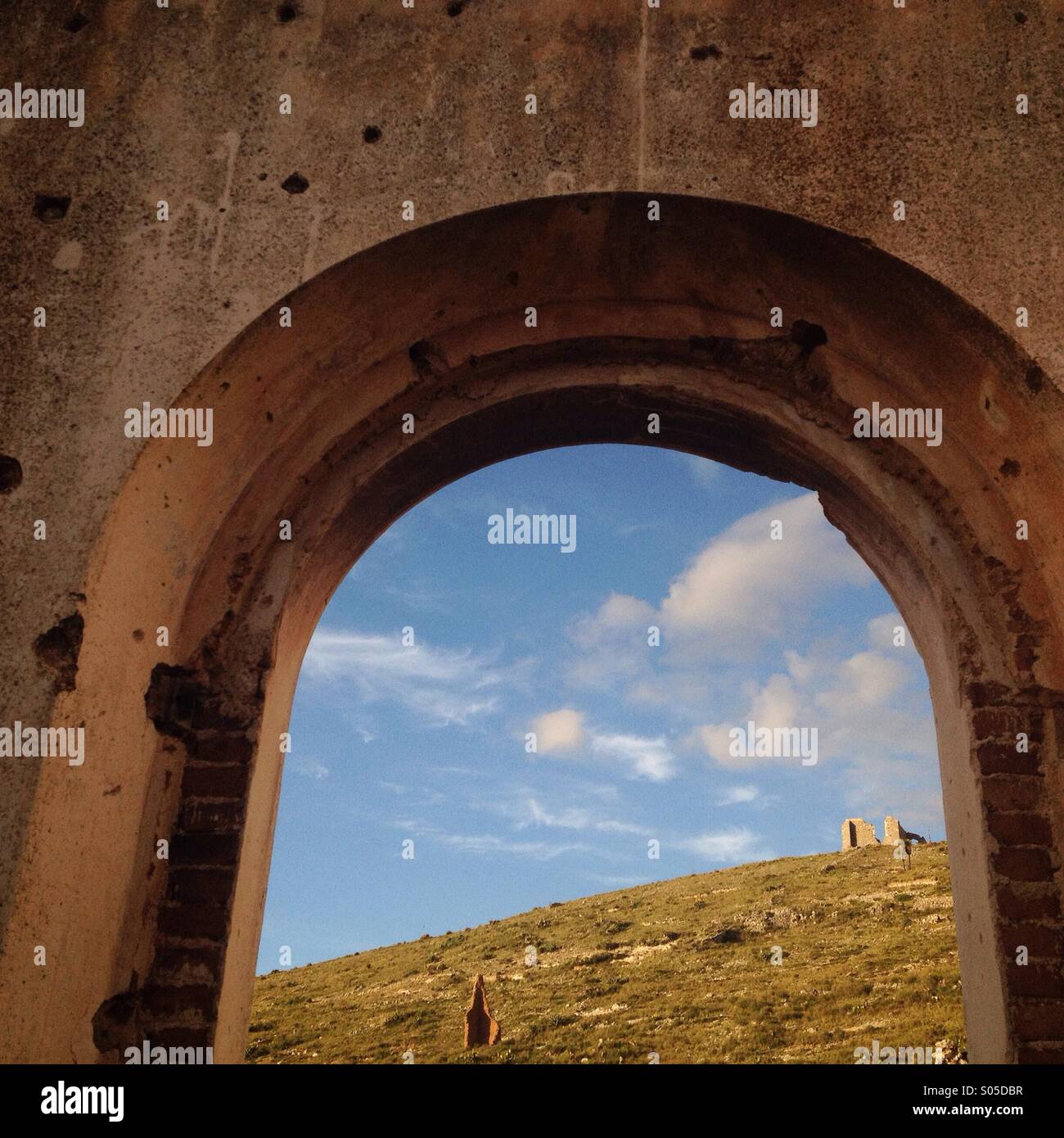 The desert seen from a window of the ruins of a mine in Real de Catorce ...