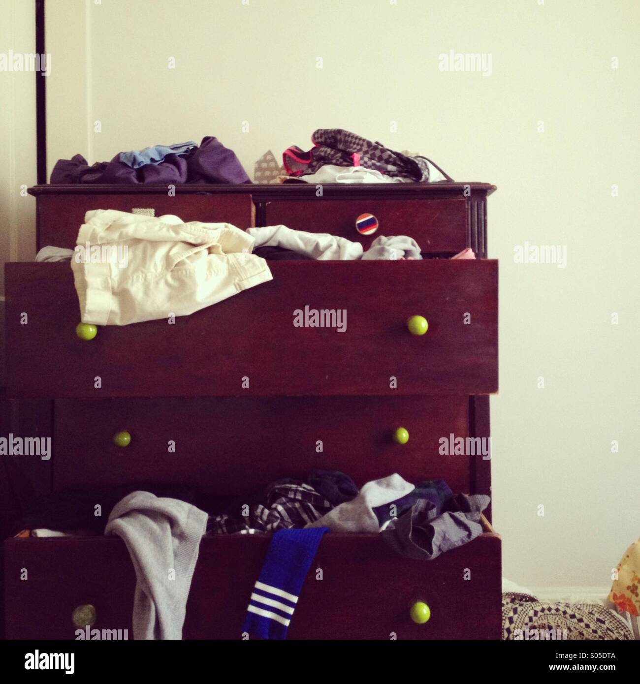 Overflowing dresser drawers Stock Photo - Alamy