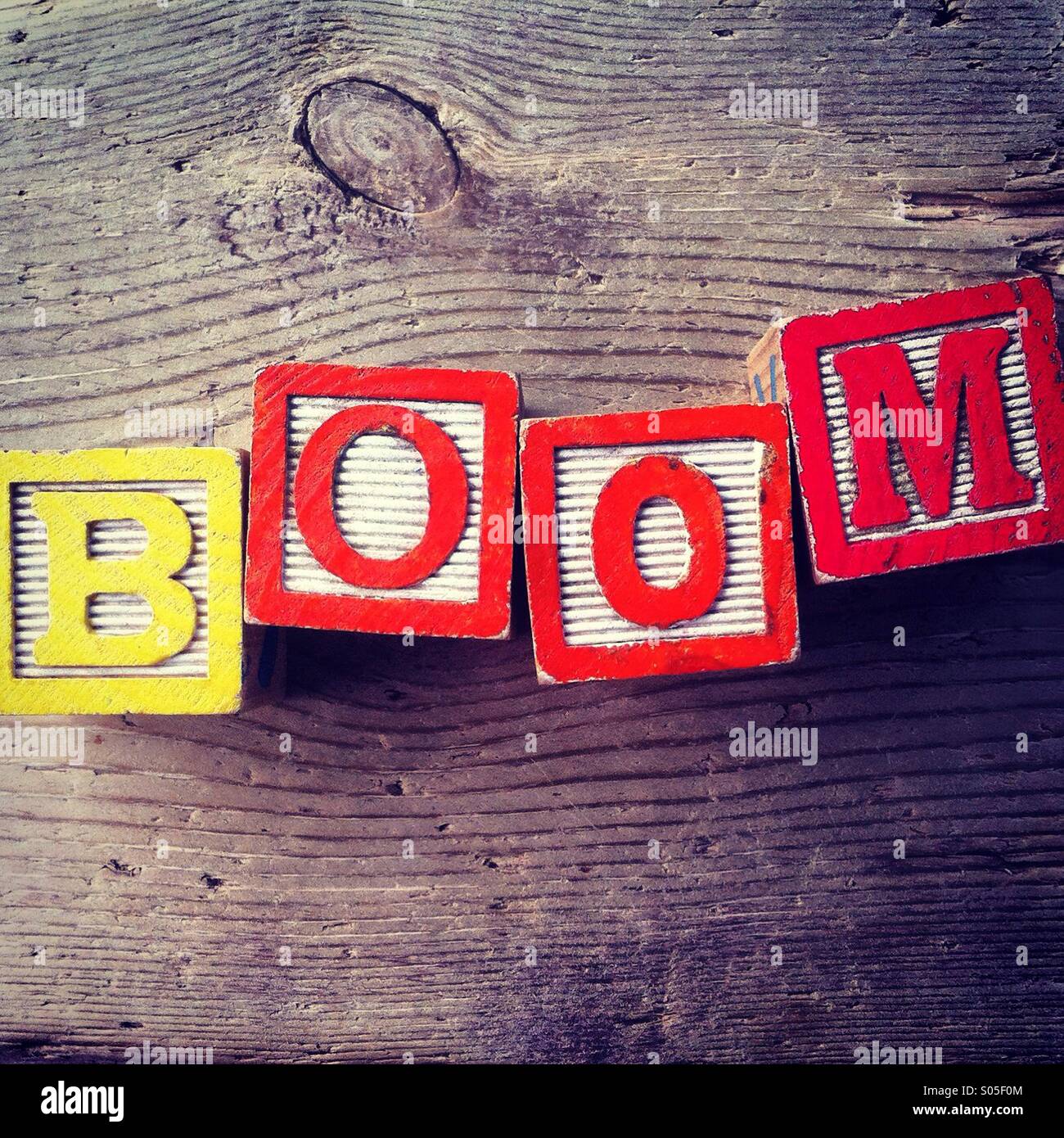 It's a photo of few wood blocks with letter on them that are combined ...