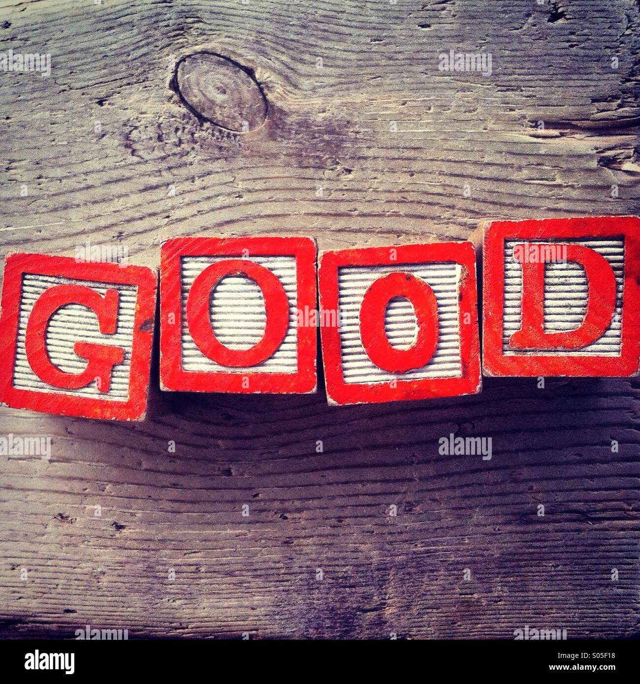 It's a photo of few wood blocks with letter on them that are combined ...