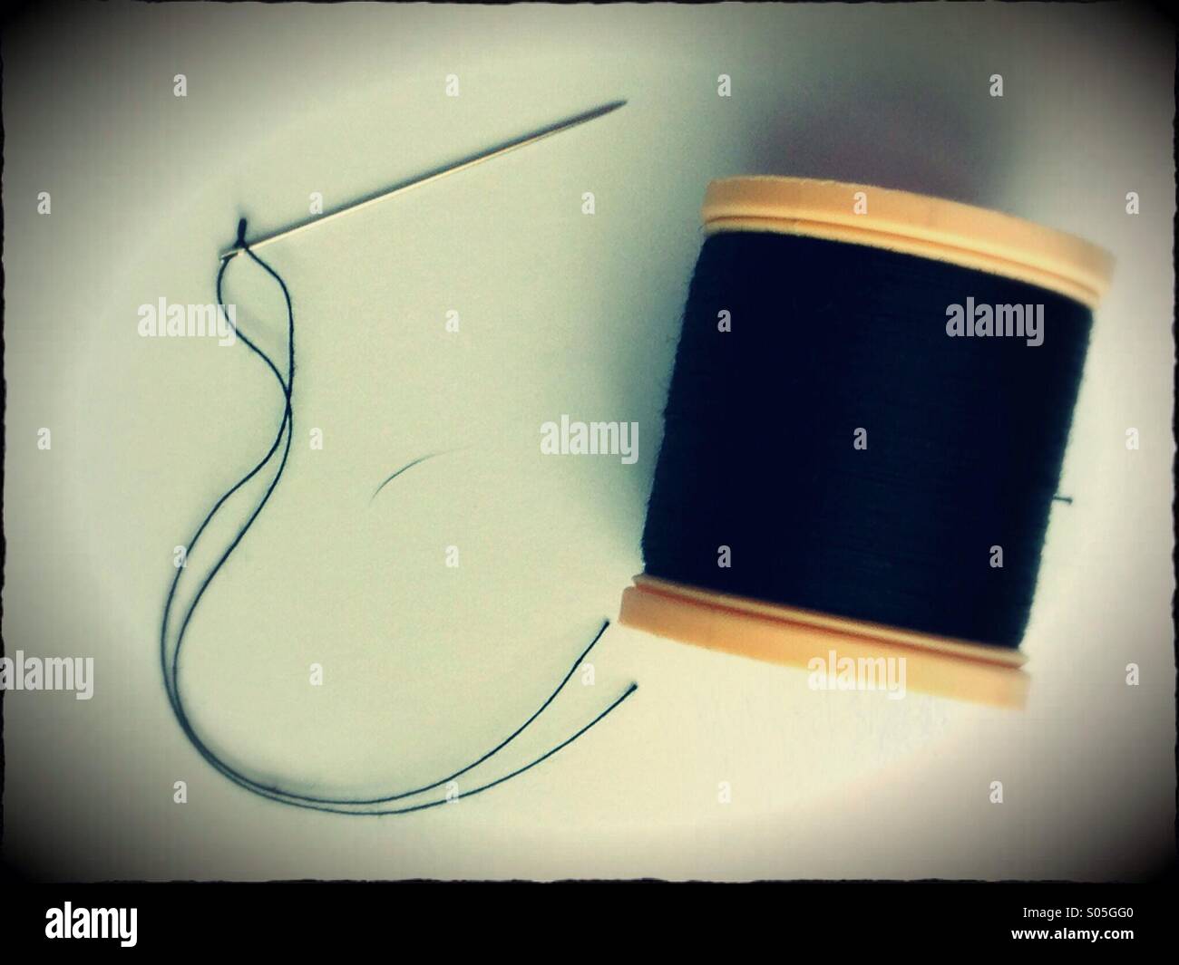 Needle and thread Stock Photo - Alamy