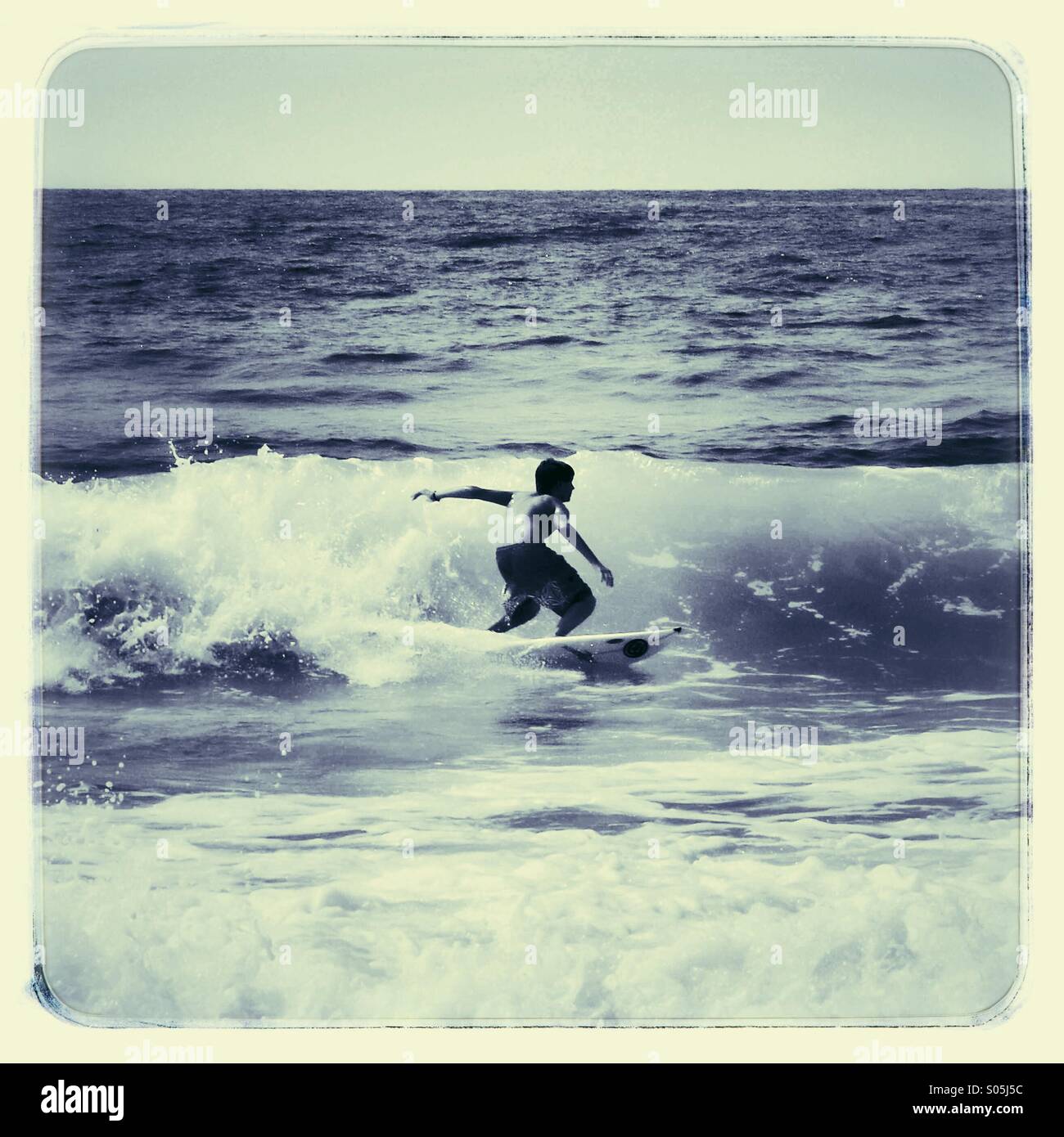 Teens surfing ocean hi-res stock photography and images - Alamy