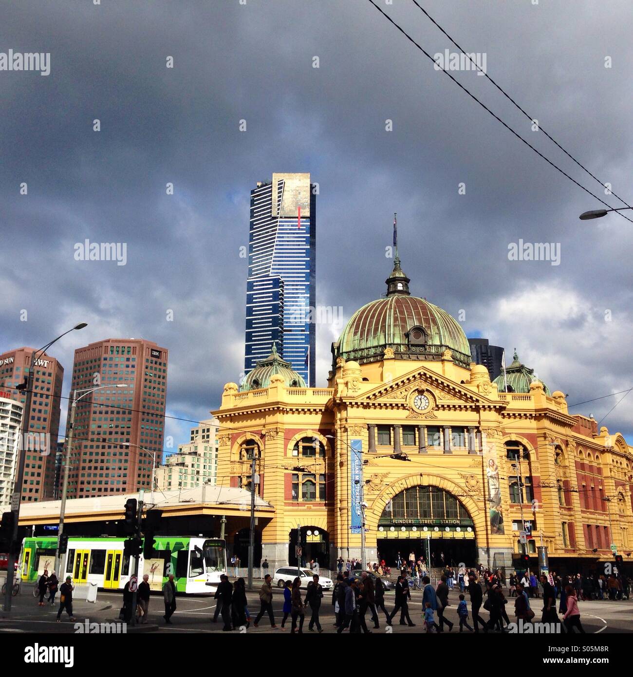 Melbourne's Finders Street Train Station with Eureka Skydeck tower in ...
