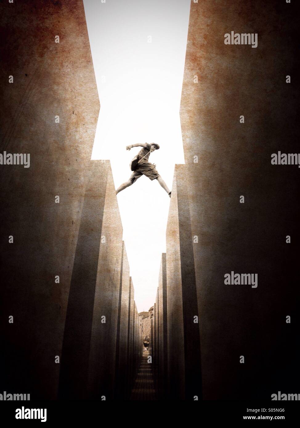 Man jumping between columns at Memorial to Murdered Jews of Europe in ...