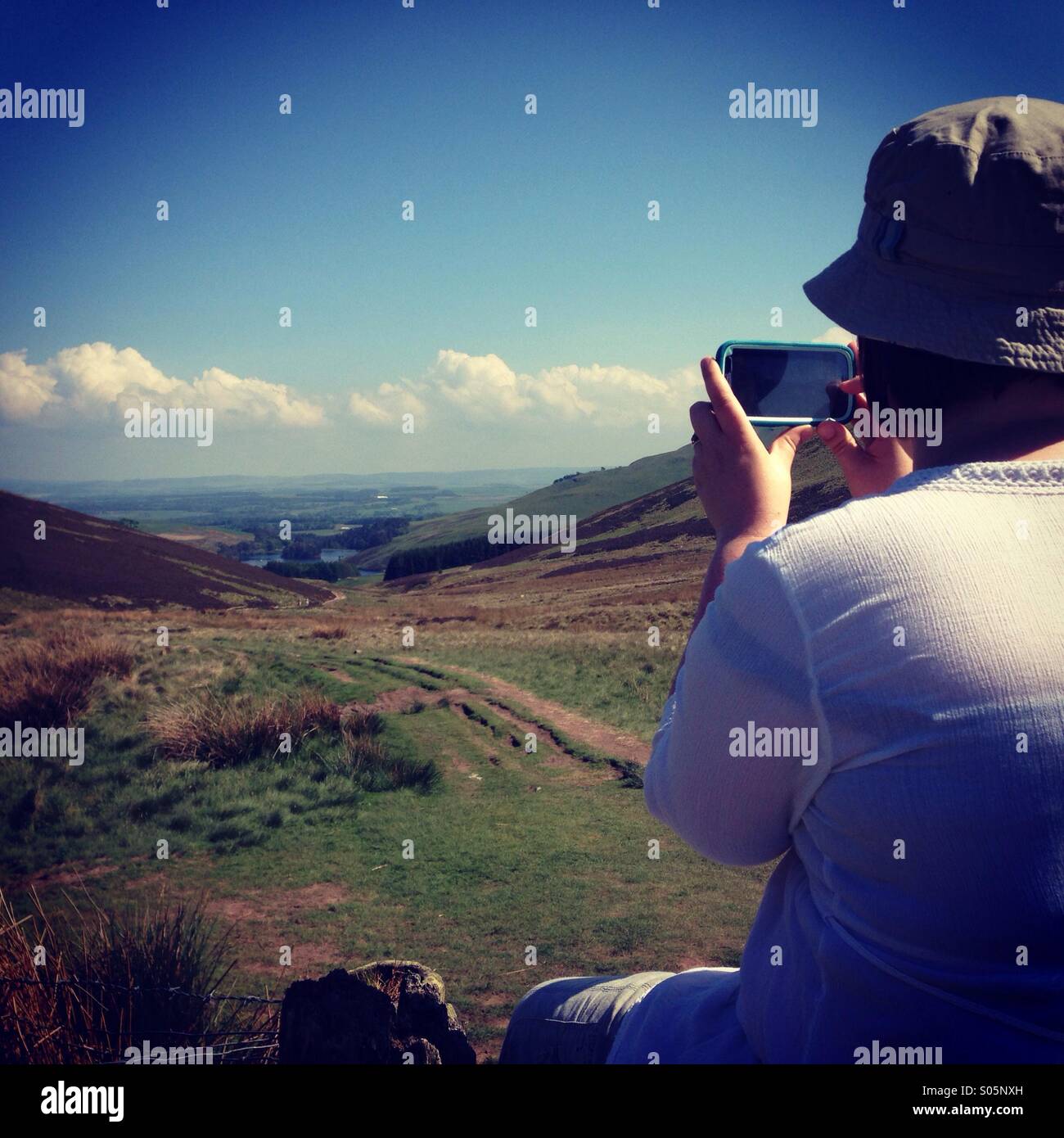 Women taking photo of scenery Stock Photo - Alamy