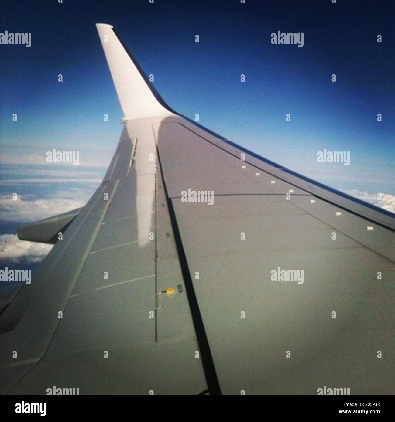 Airplane wing during flight Stock Photo - Alamy