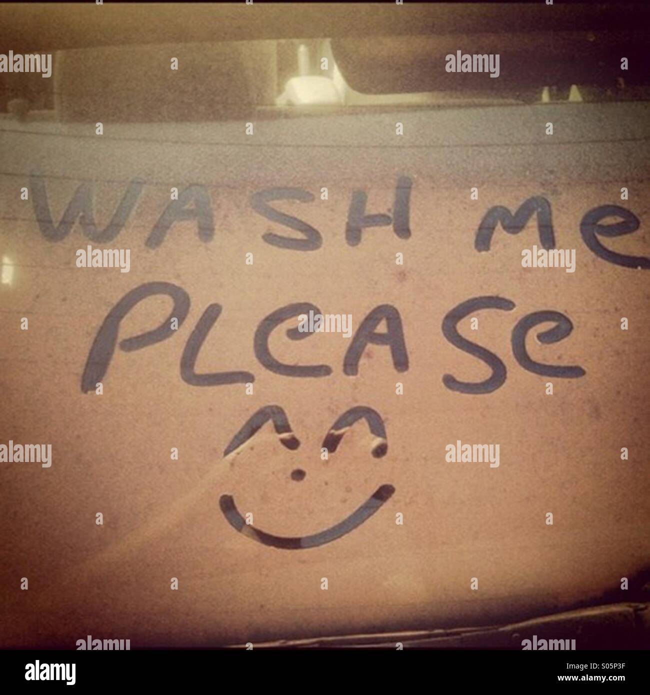 Wash me please written into dirt on a car window Stock Photo - Alamy
