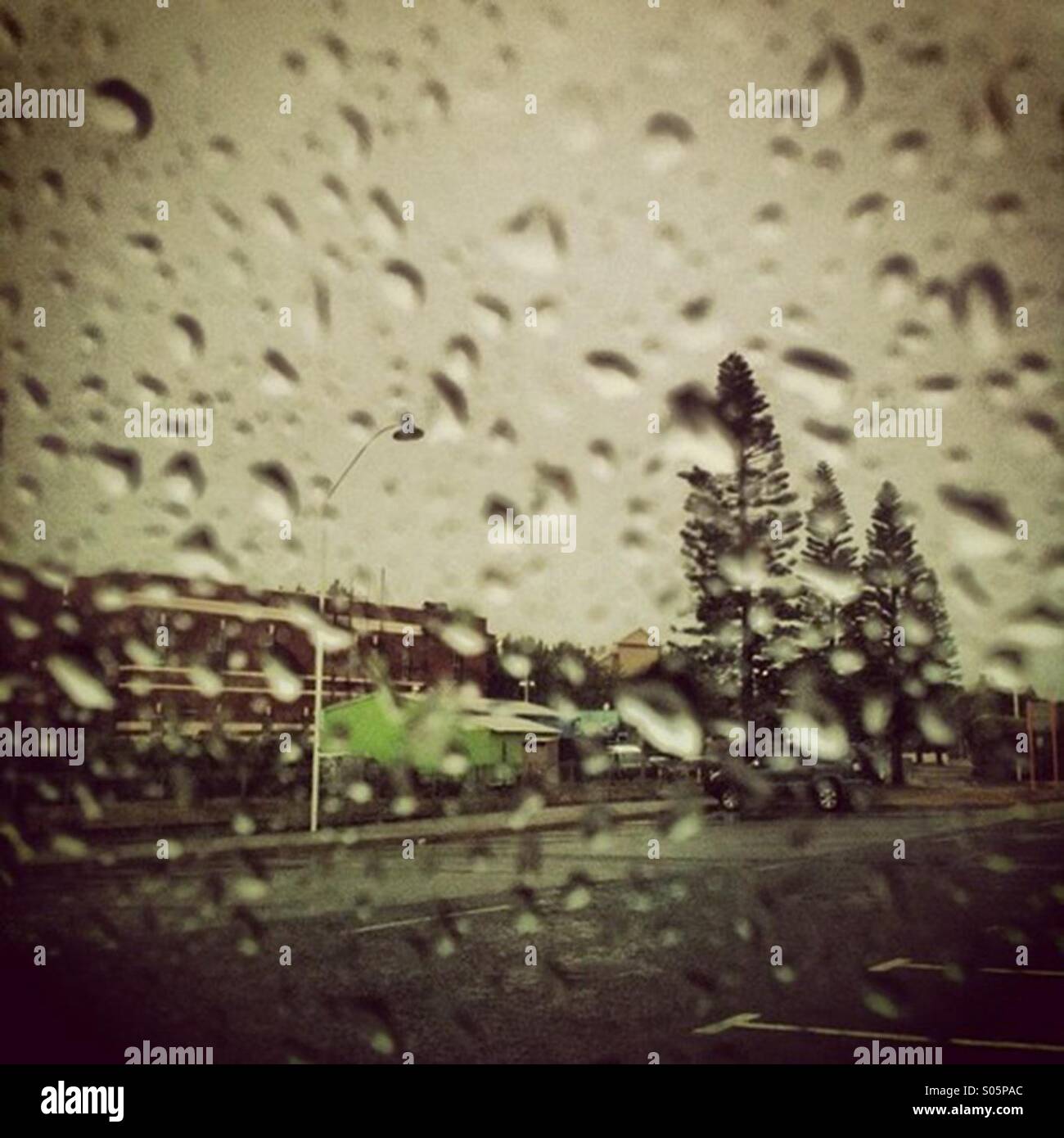 Rain on window view Stock Photo - Alamy