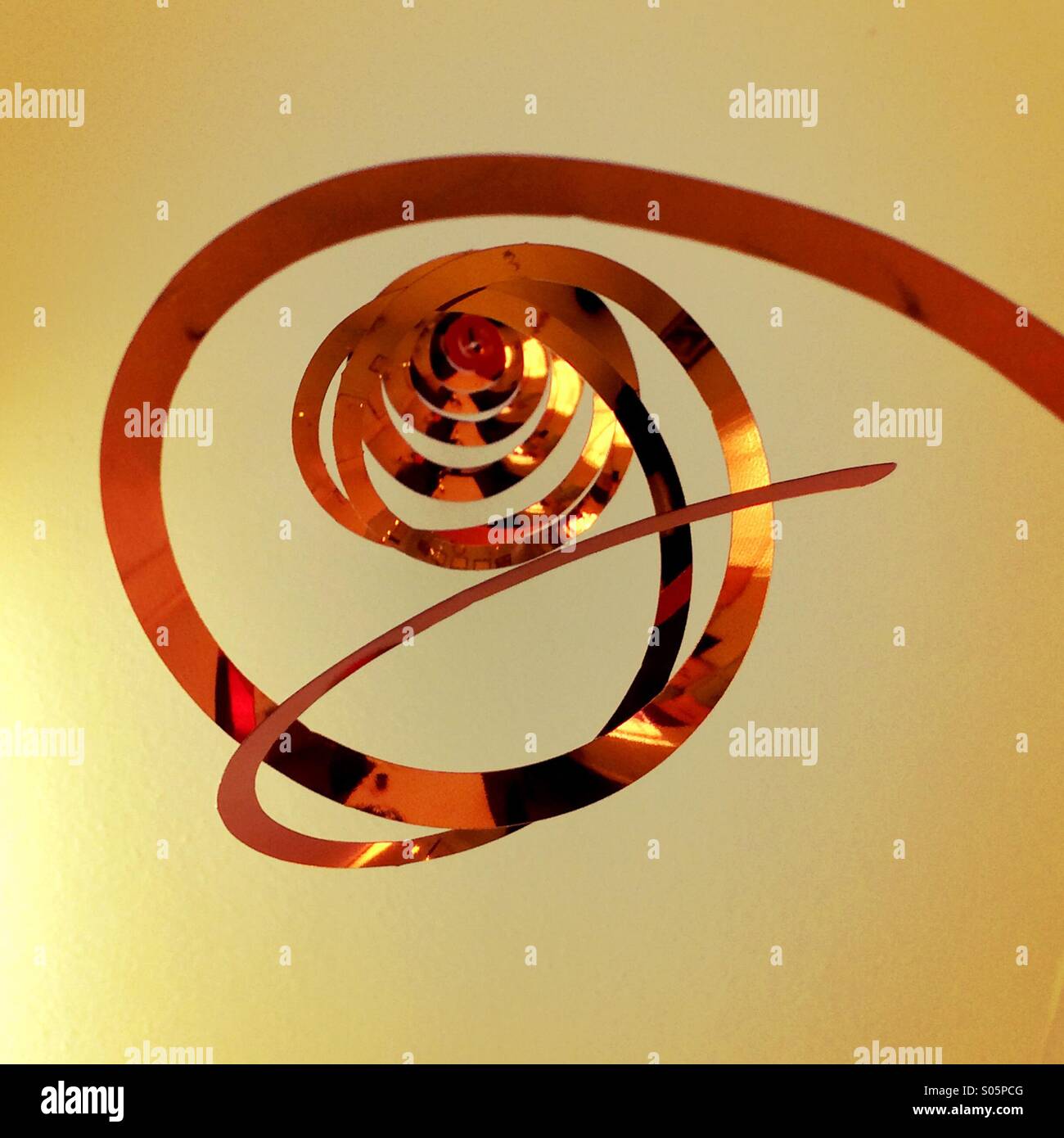 Metallic swirl party favor Stock Photo - Alamy