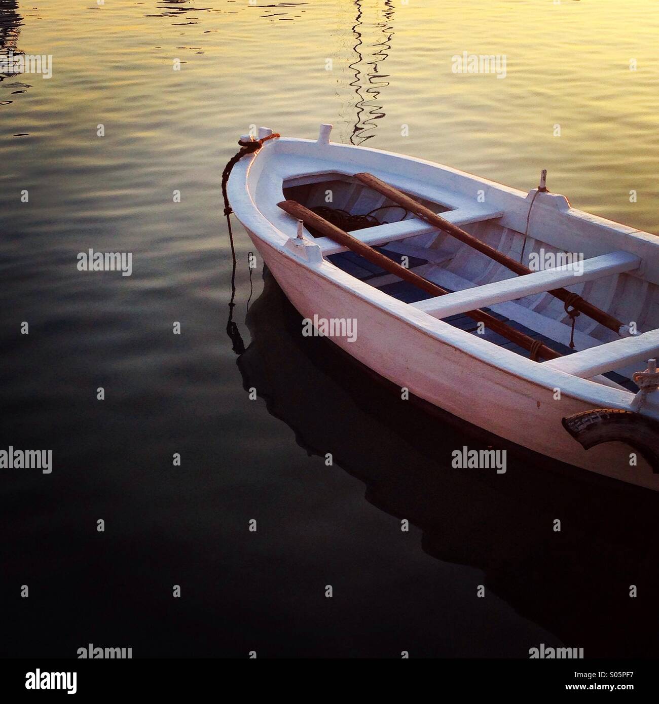 Small vintage wooden boat at sea Stock Photo - Alamy