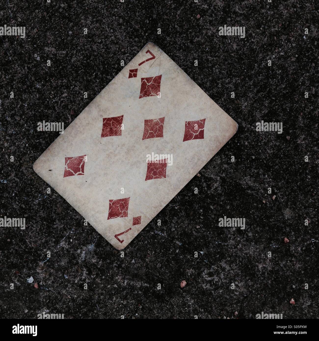 Playing card on concrete background Stock Photo - Alamy