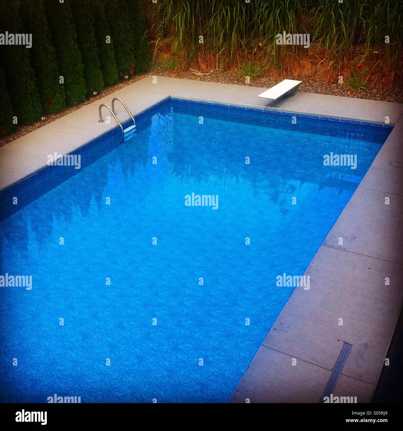 Early morning quiet around the pool Stock Photo - Alamy