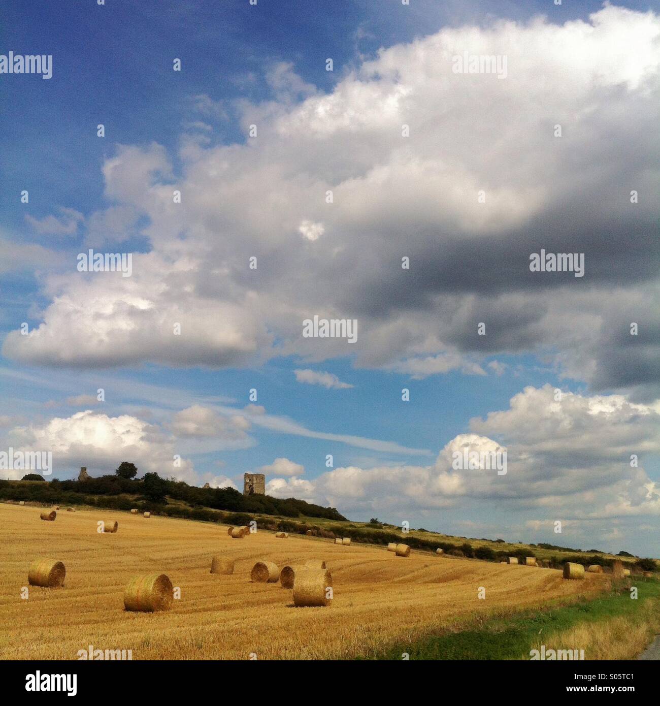 View of Hadleigh Castle with bales of hay and a vast sky, August 2014 ...