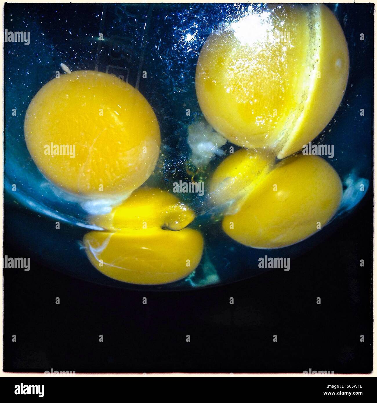 4 egg yolks Stock Photo - Alamy