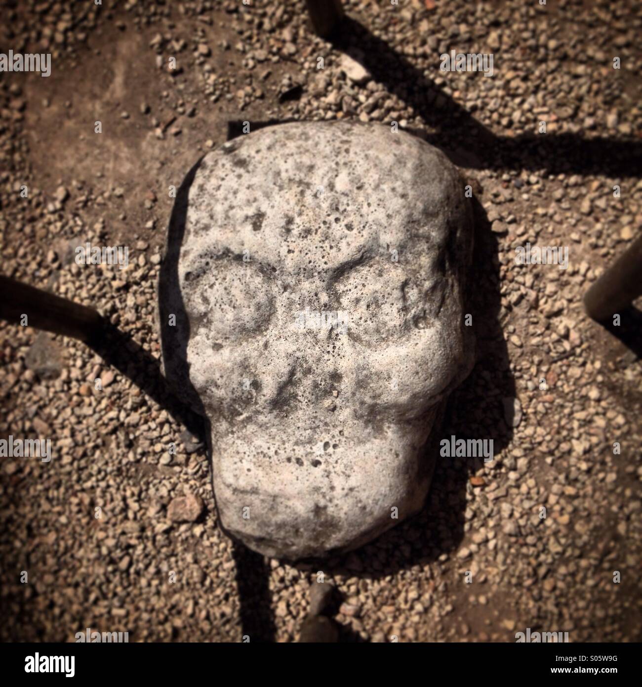 A stone with the form of a skull is displayed in the Mayan Ball Game ...