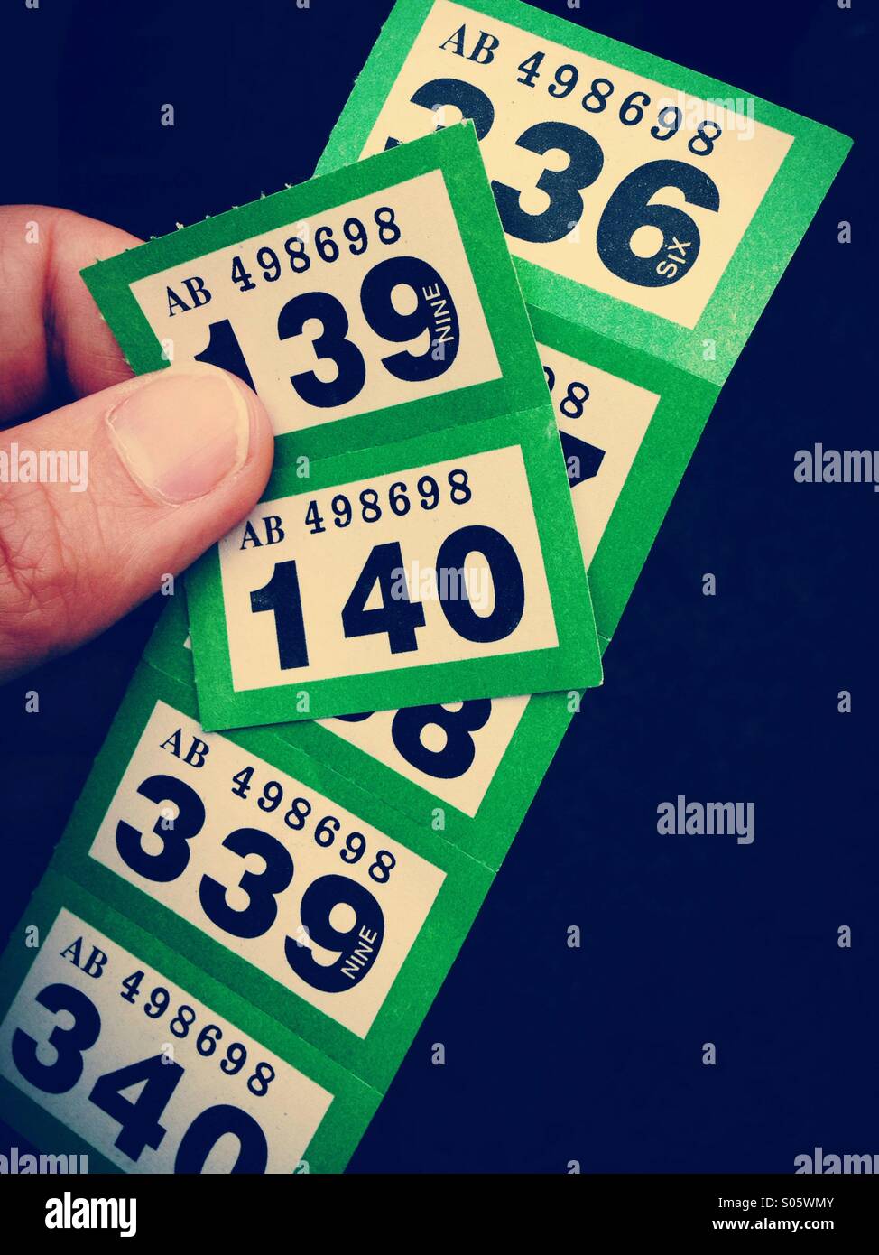 Hand holding tickets hi-res stock photography and images - Alamy