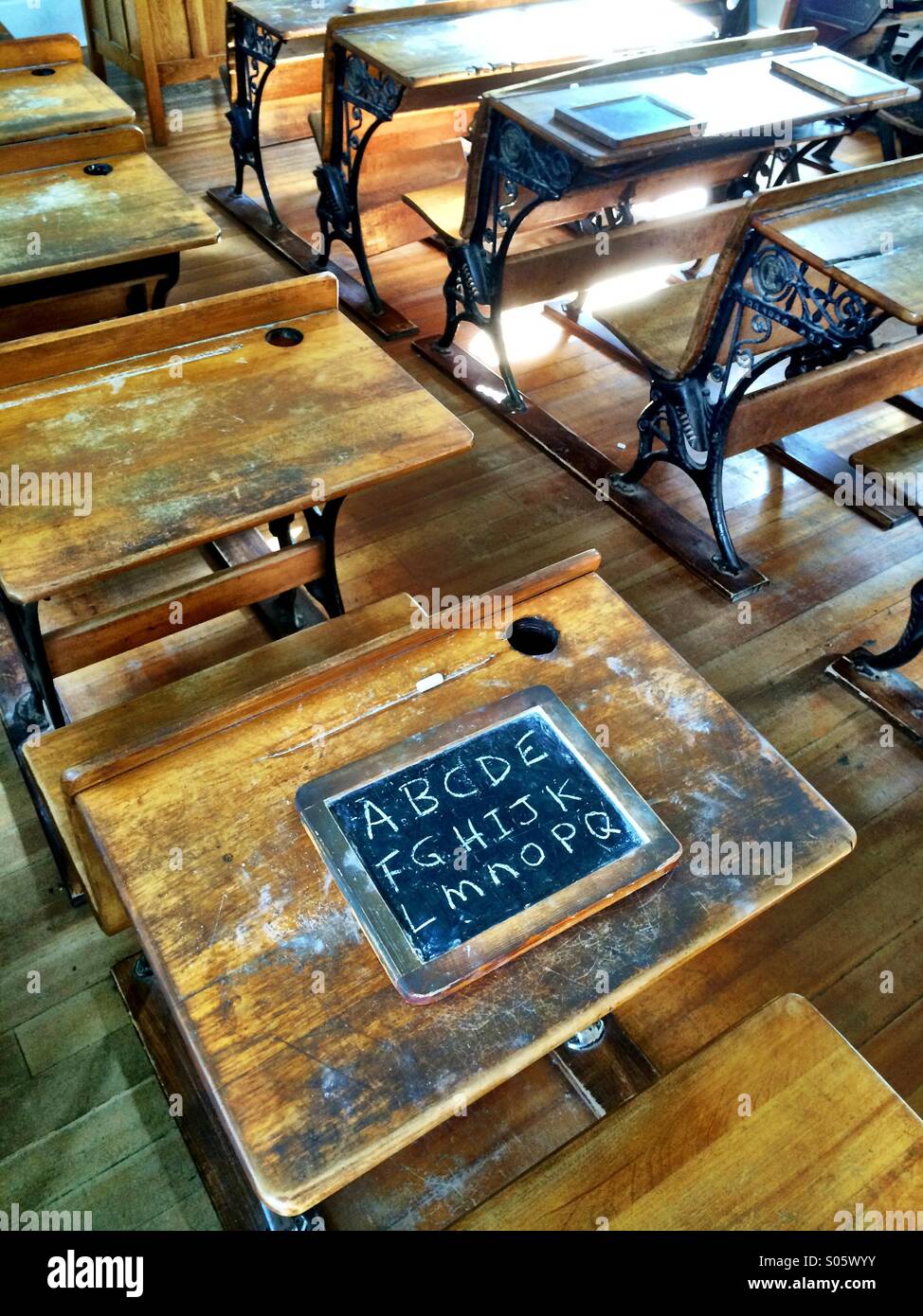 Vintage classroom with chalkboard on desk Stock Photo - Alamy