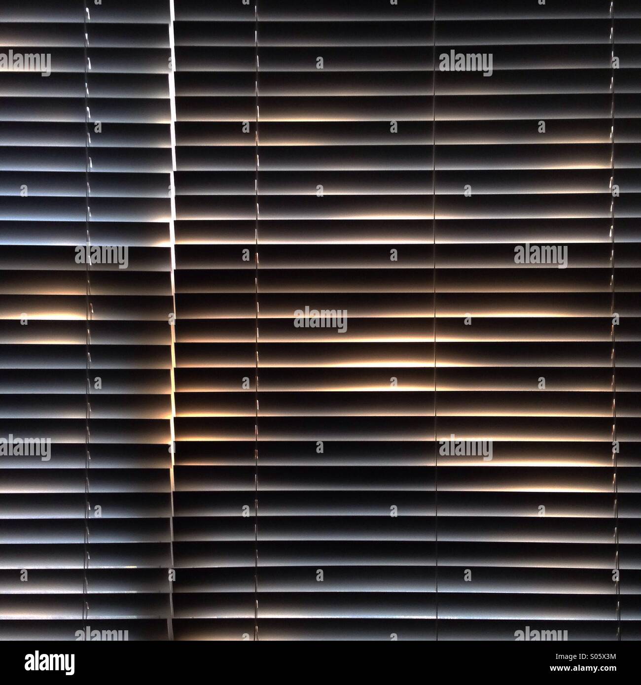 Sunlight through blinds hi-res stock photography and images - Alamy