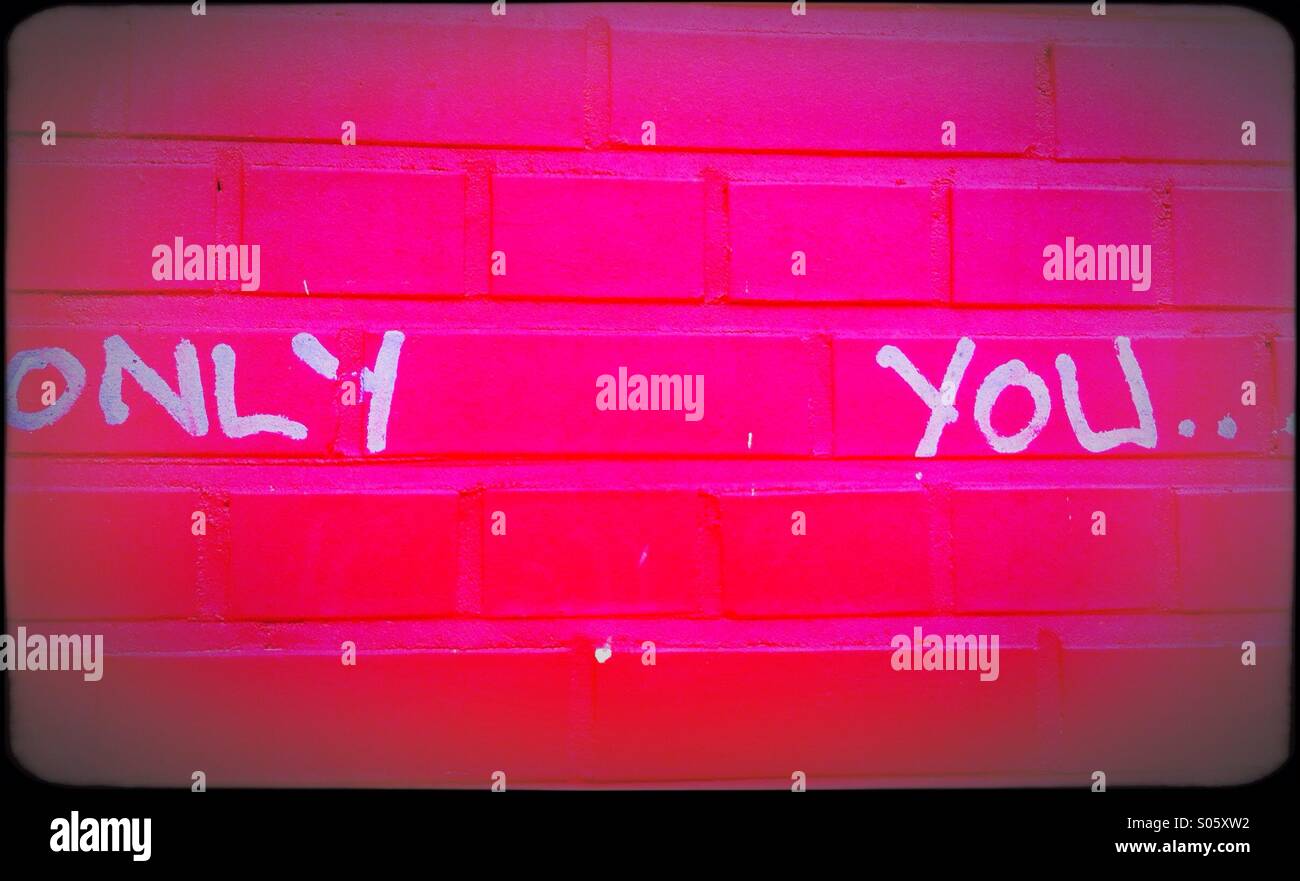 "Only you" text on pink wall Stock Photo - Alamy